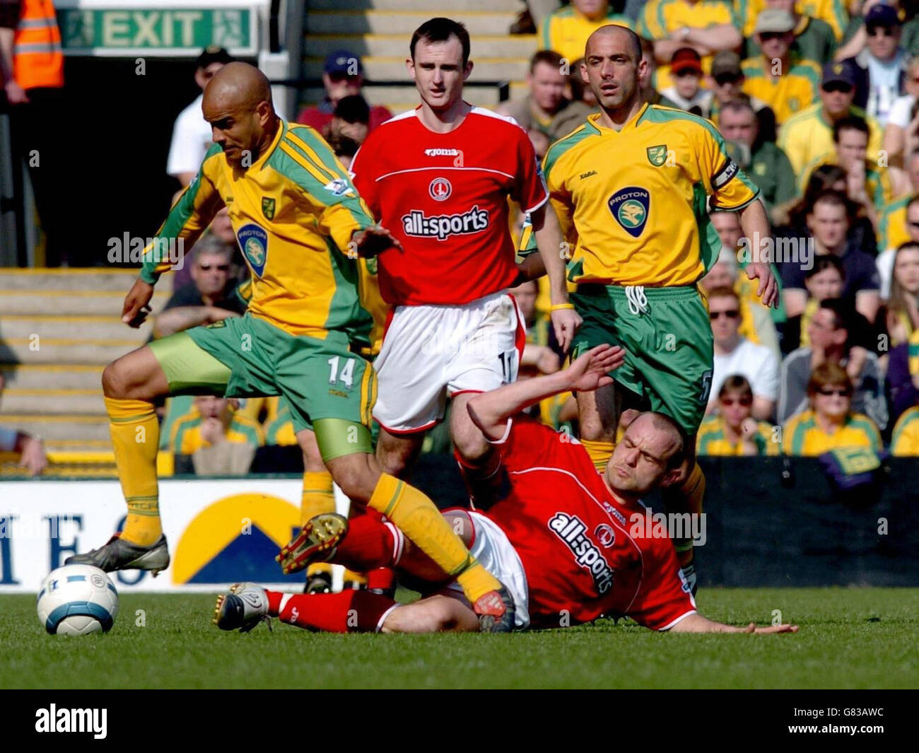 Norwich City's Leon McKensie (L) gets away with Charton Athletic's ...