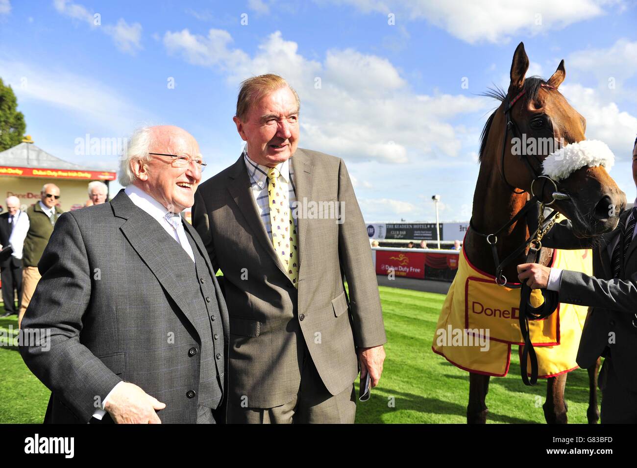 President Michael D Higgins congratulates trainer Dermot Weld after ...