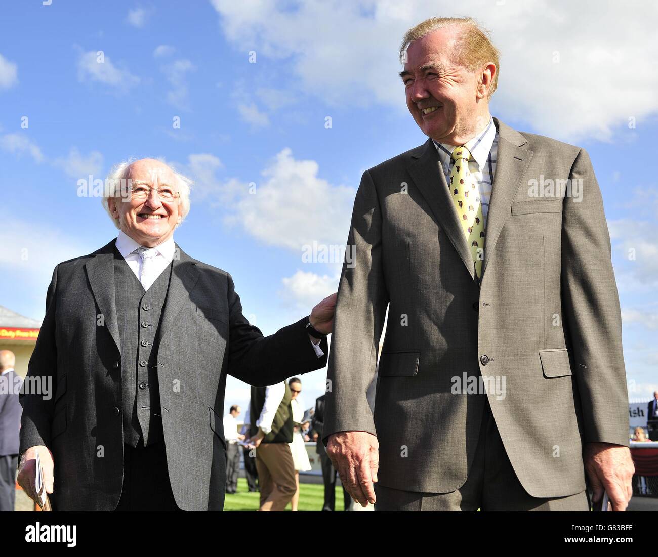 President Michael D Higgins congratulates trainer Dermot Weld after ...