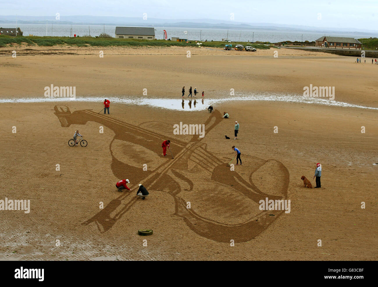 People watch as Jamie Wardley (centre left) and Claire Jamieson (centre ...