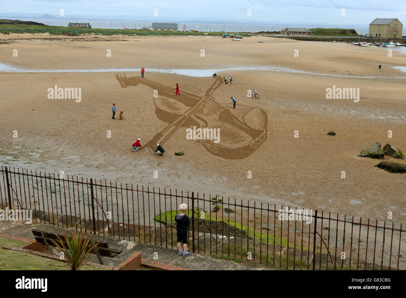 People watch as Jamie Wardley (centre left) and Claire Jamieson (centre ...