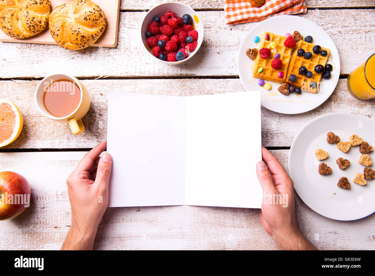 Hands of man holding empty greeting card. Breakfast meal Stock Photo ... Hands of man holding empty greeting card. Breakfast meal Stock Photo ...