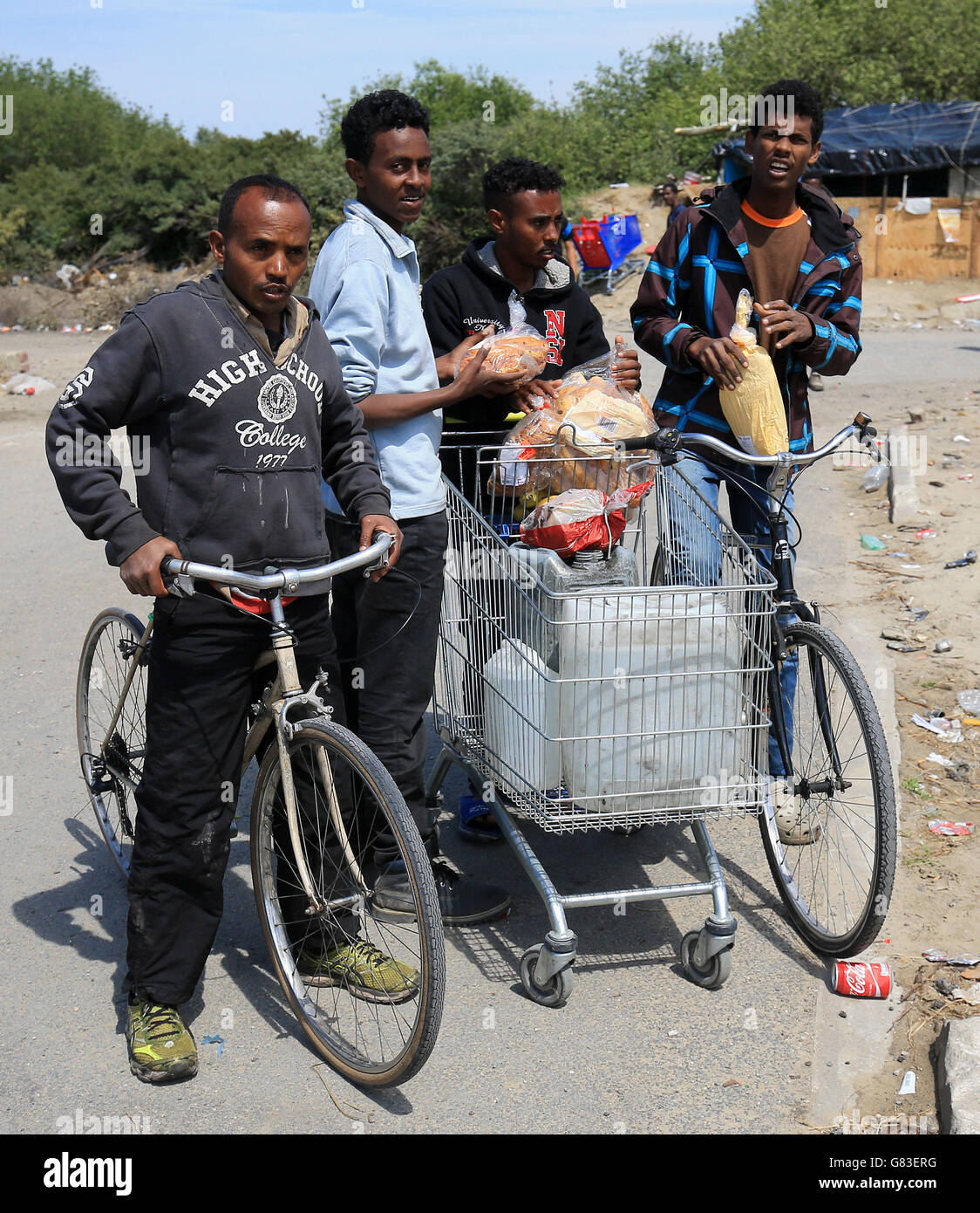 Group of migrants collect donated food in squalid camp dubbed hi-res ...