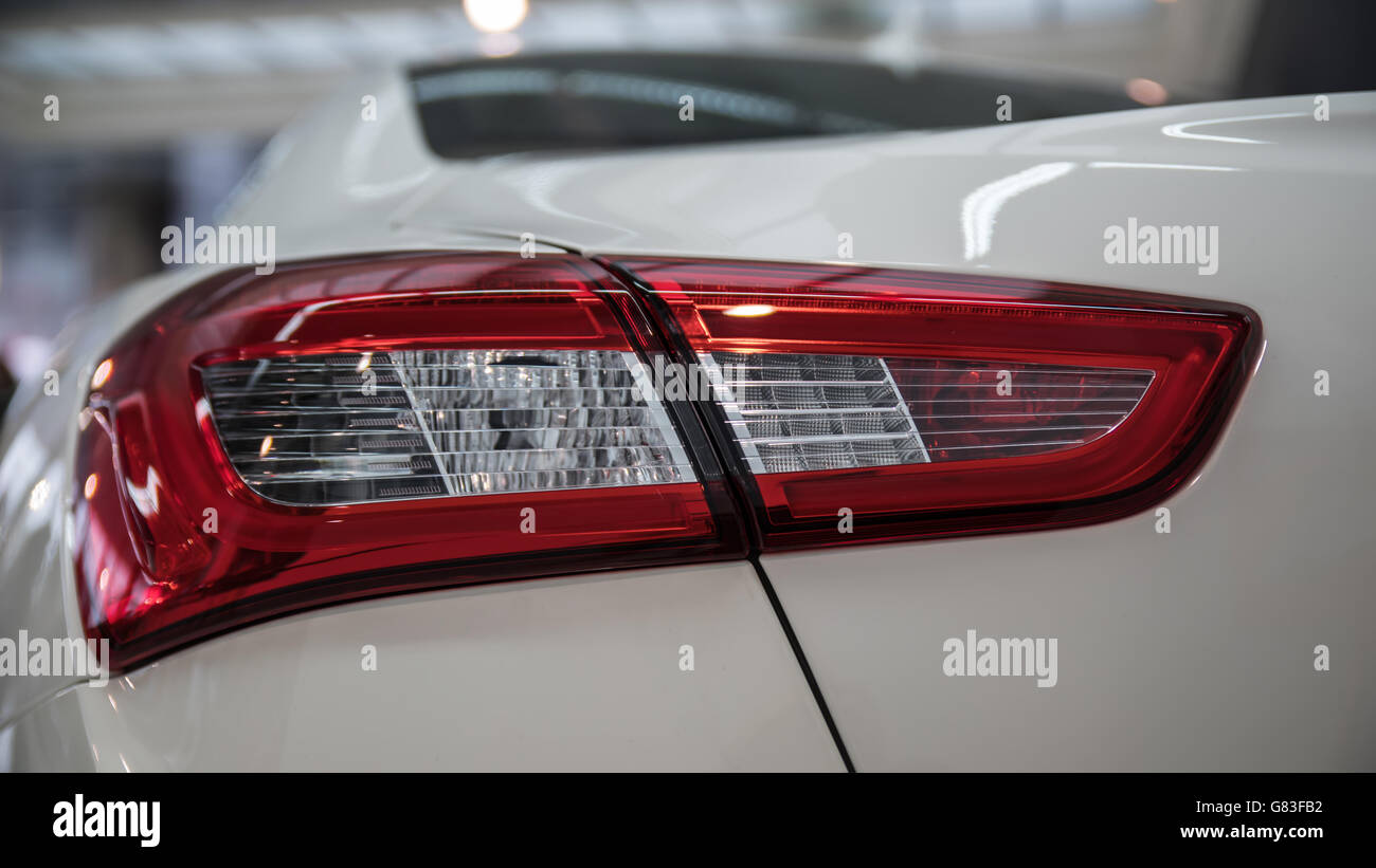 Detail on the rear light of a white car Stock Photo - Alamy