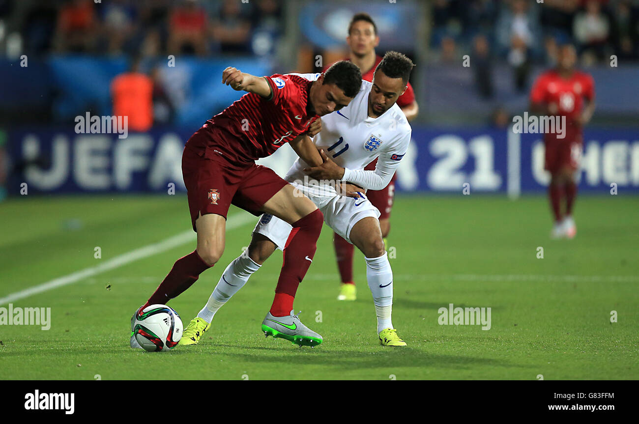 Portugal's Tiago Ilori (left) and England's Nathan Redmond (right ...