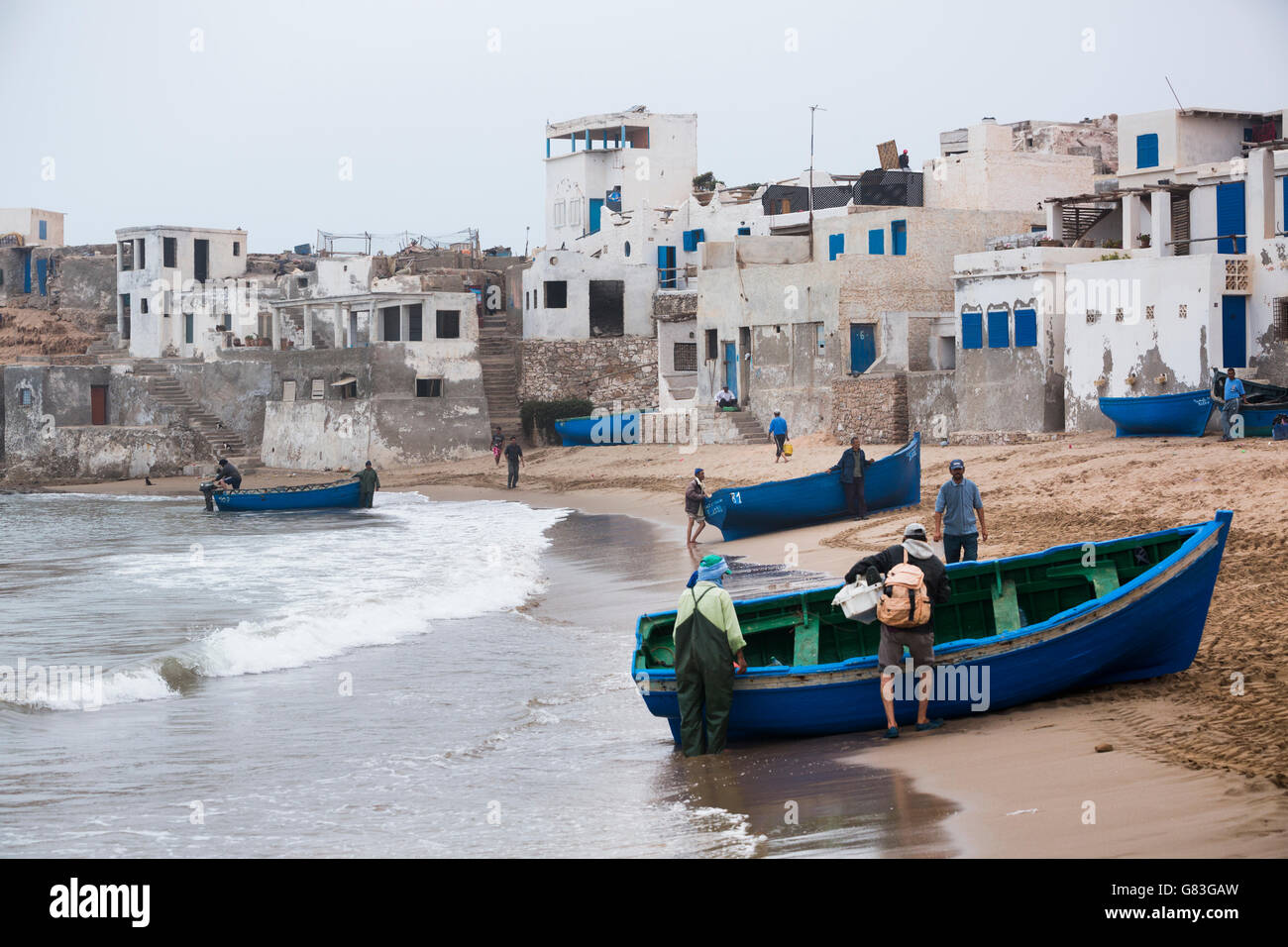 Fisherman land ashore in Tifnit beach near Agadir, Morocco Stock Photo ...