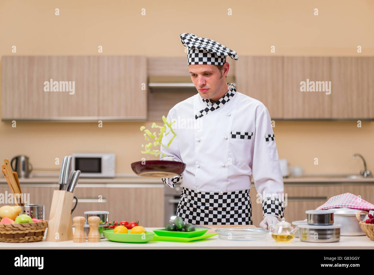 Male cook preparing food in the kitchen Stock Photo - Alamy