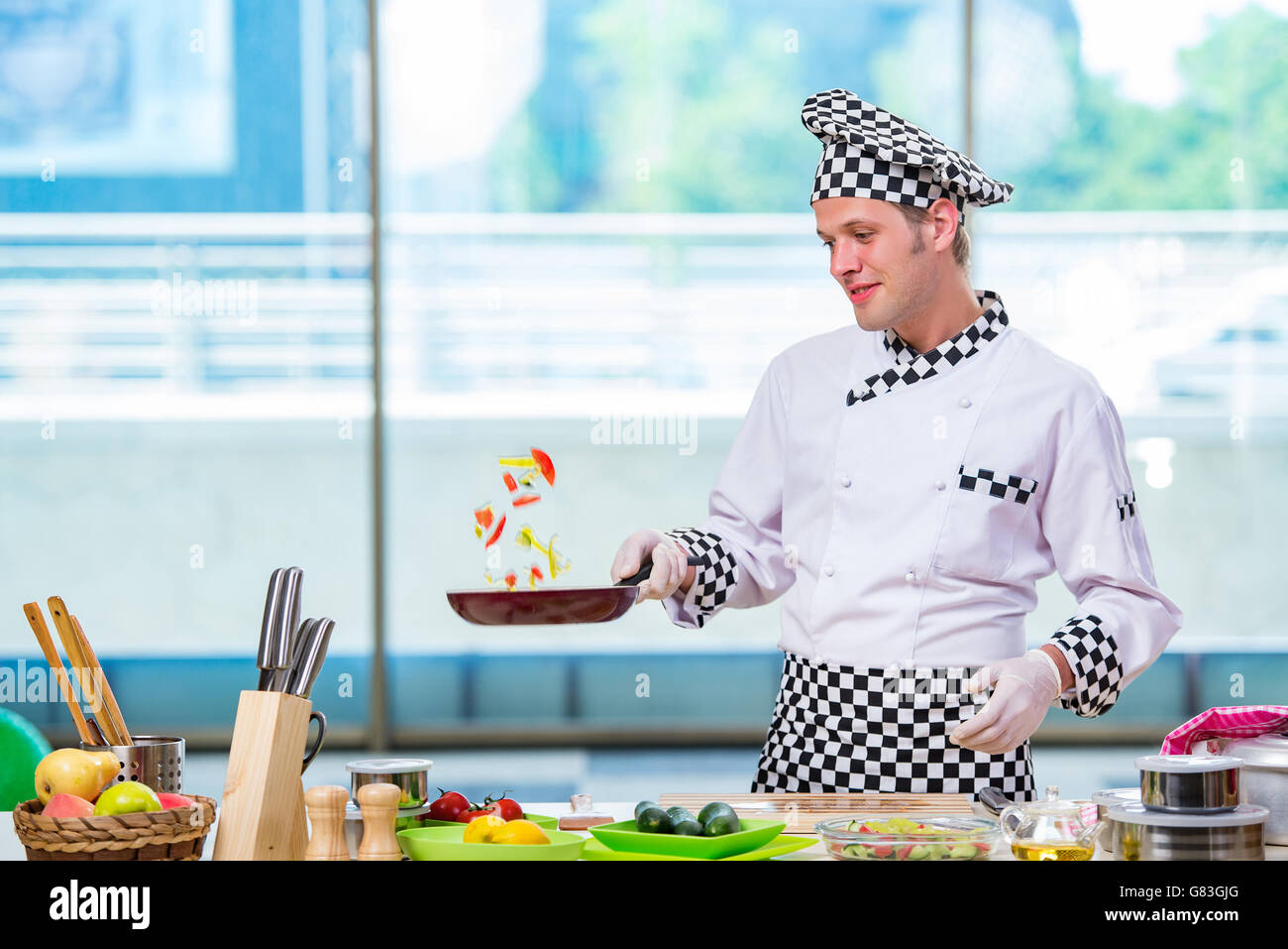 Male cook preparing food in the kitchen Stock Photo - Alamy