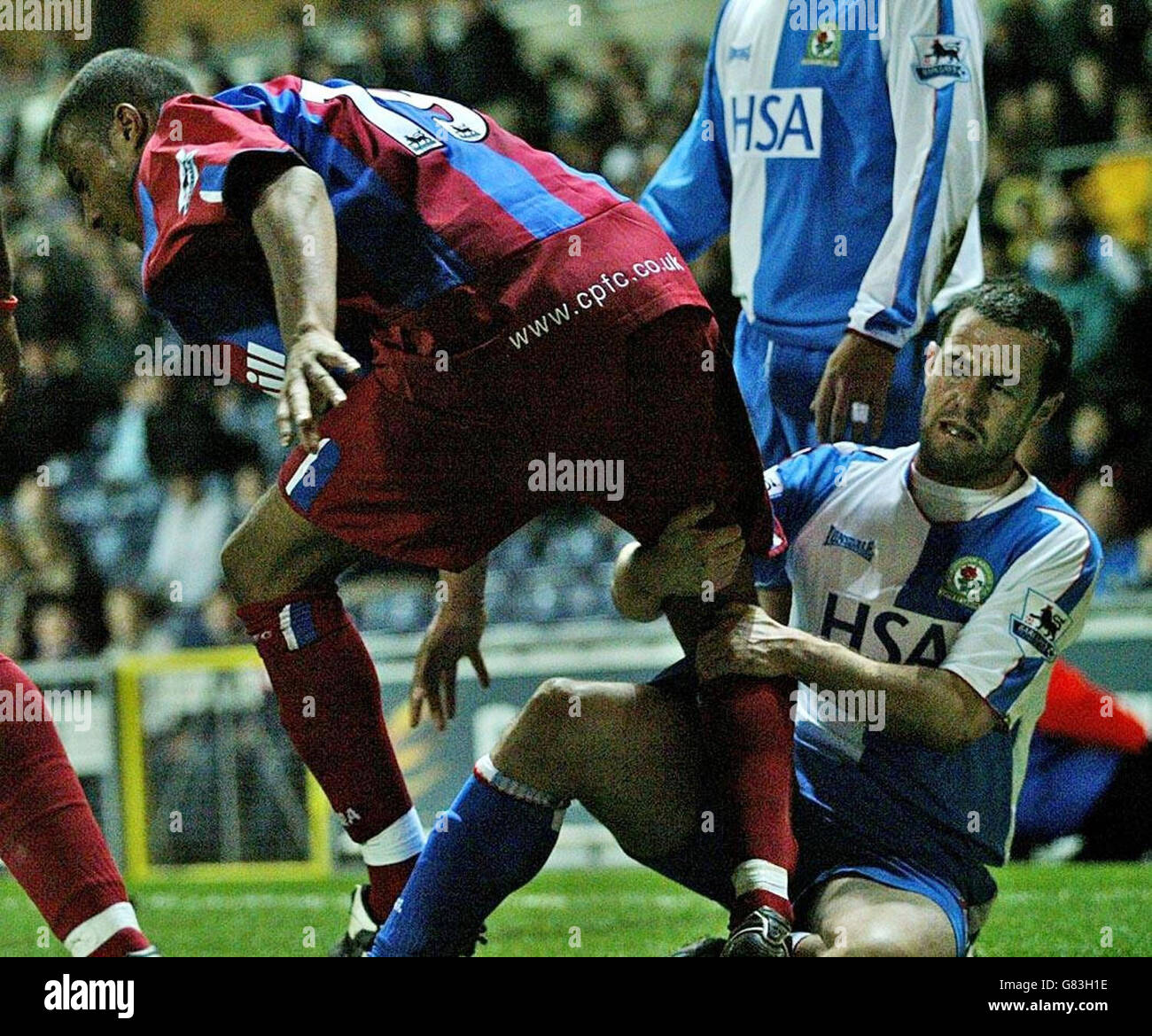 Blackburn's David Thompson (R) gets a grip of Crystal Palace's Tom ...