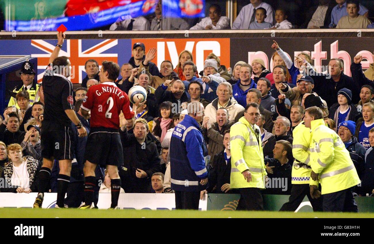 Manchester United's Gary Neville is shown the red card by referee Phil ...