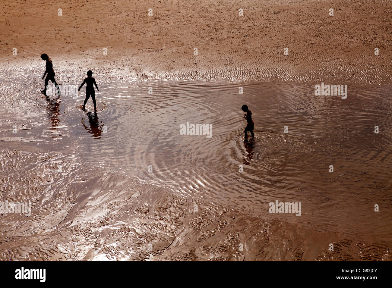 Children paddling sea hi-res stock photography and images - Alamy