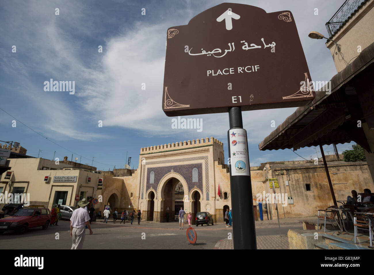 A directional sign for self-guided walking tours helps guide tourists ...
