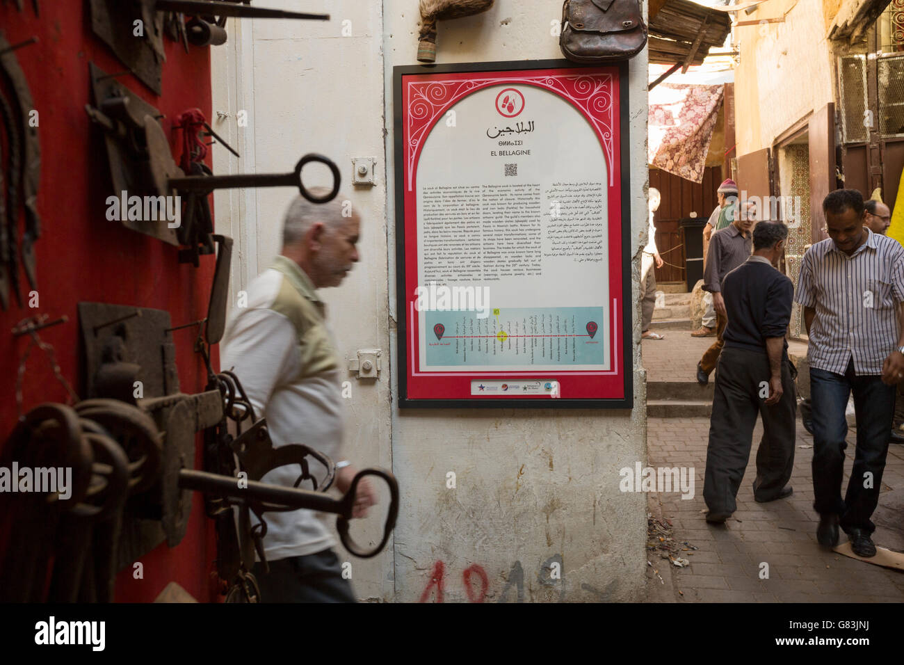 A directional sign for self-guided walking tours helps guide tourists ...