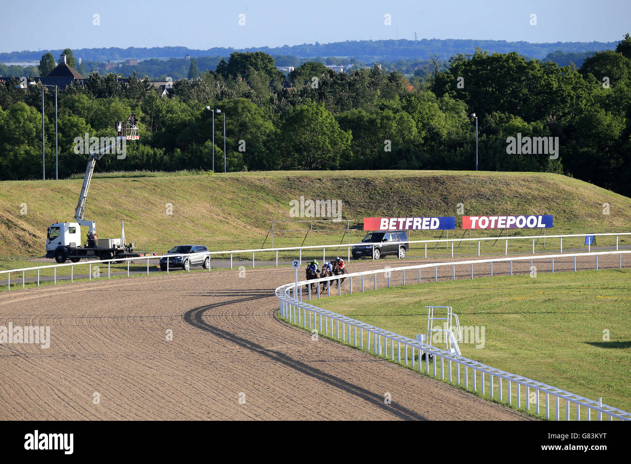 Horse Racing - Chelmsford City Racecourse. The field head around the ...