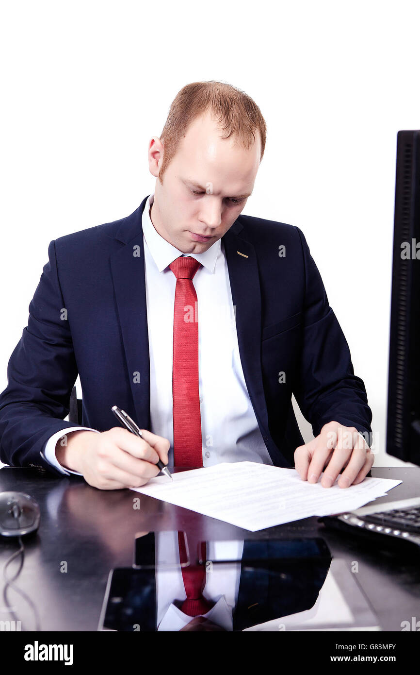 Businessman signs documents in the workplace Stock Photo - Alamy