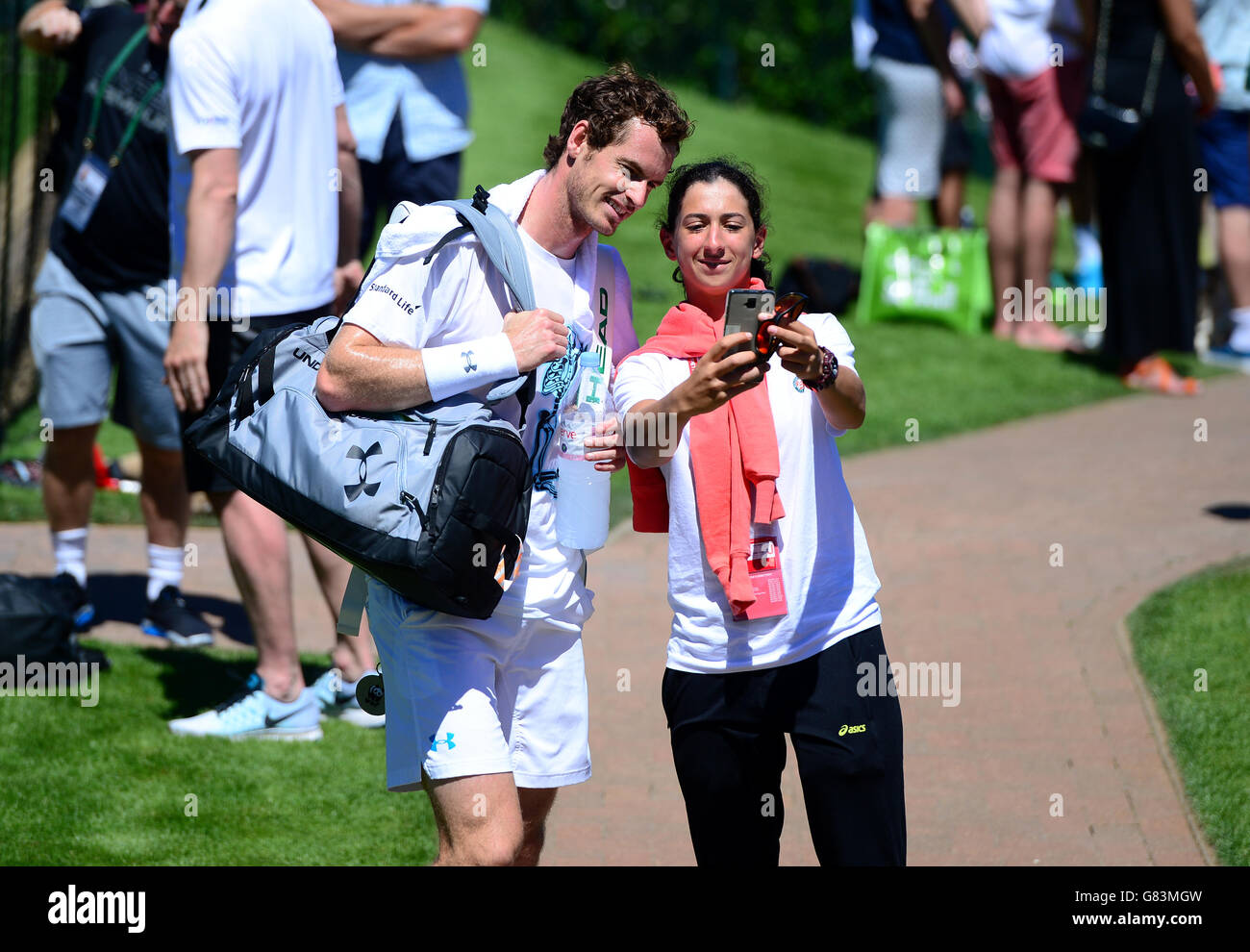 Andy Murray poses for a selfie with a fan after practicing on day two ...