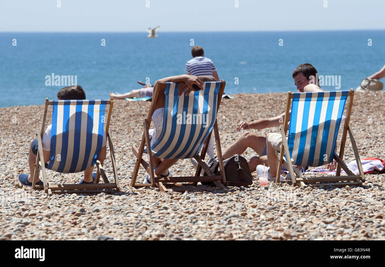 Sunbathers enjoy warm weather on beach in brighton hi-res stock ...