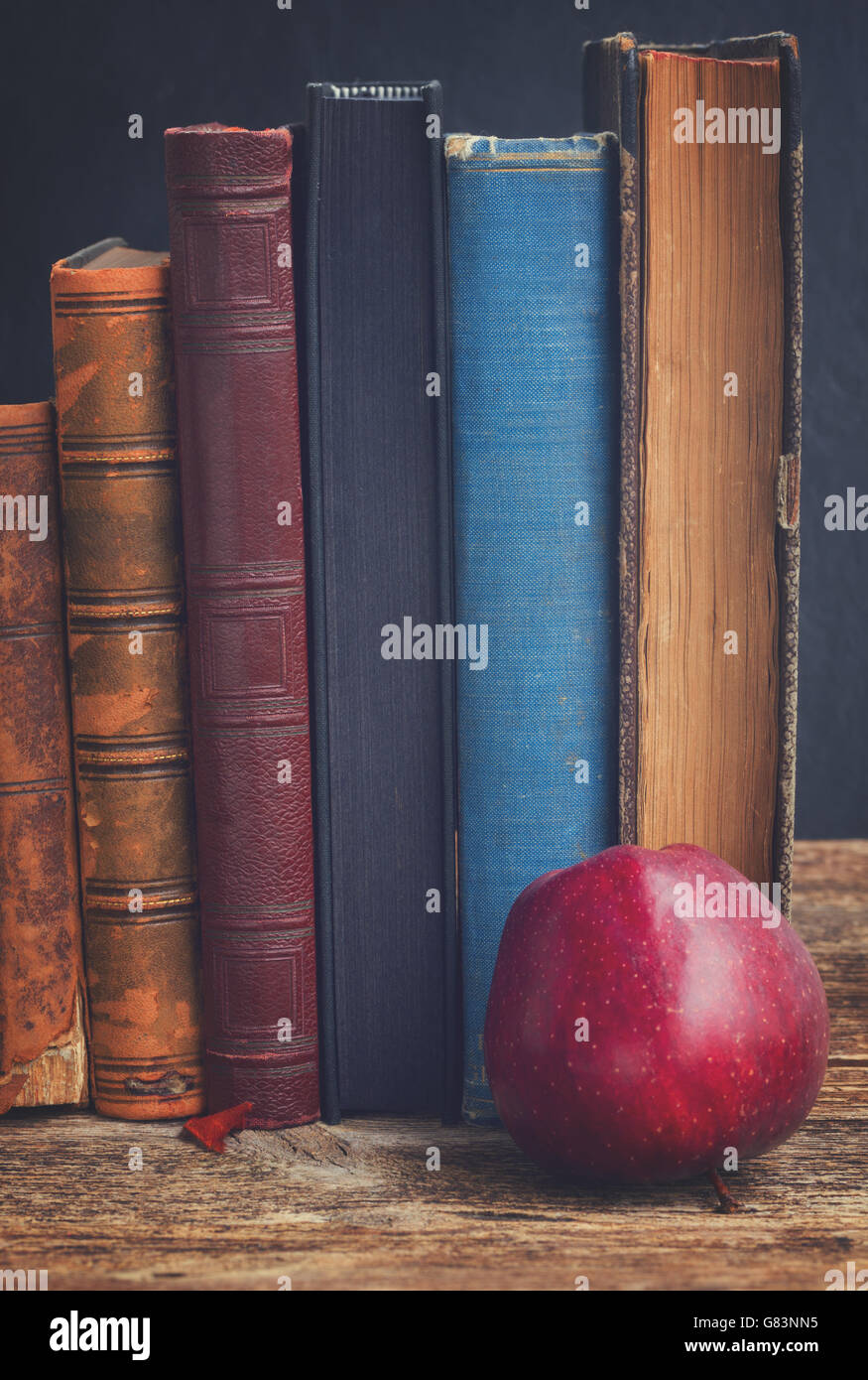 Bookshelf and apple Stock Photo - Alamy