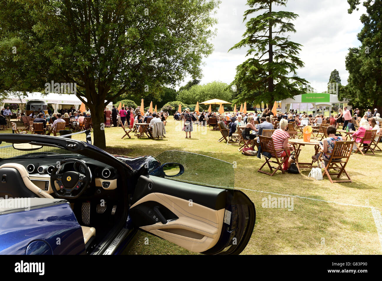 A Ferrari can be seen as guests enjoy the hospitality during day one of ...