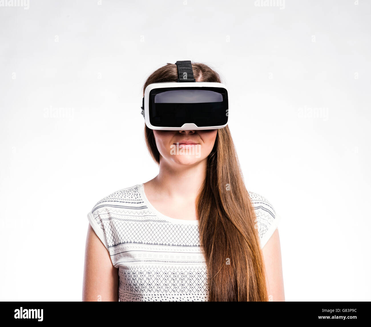 Woman with virtual reality goggles. Studio shot, gray background Stock ...