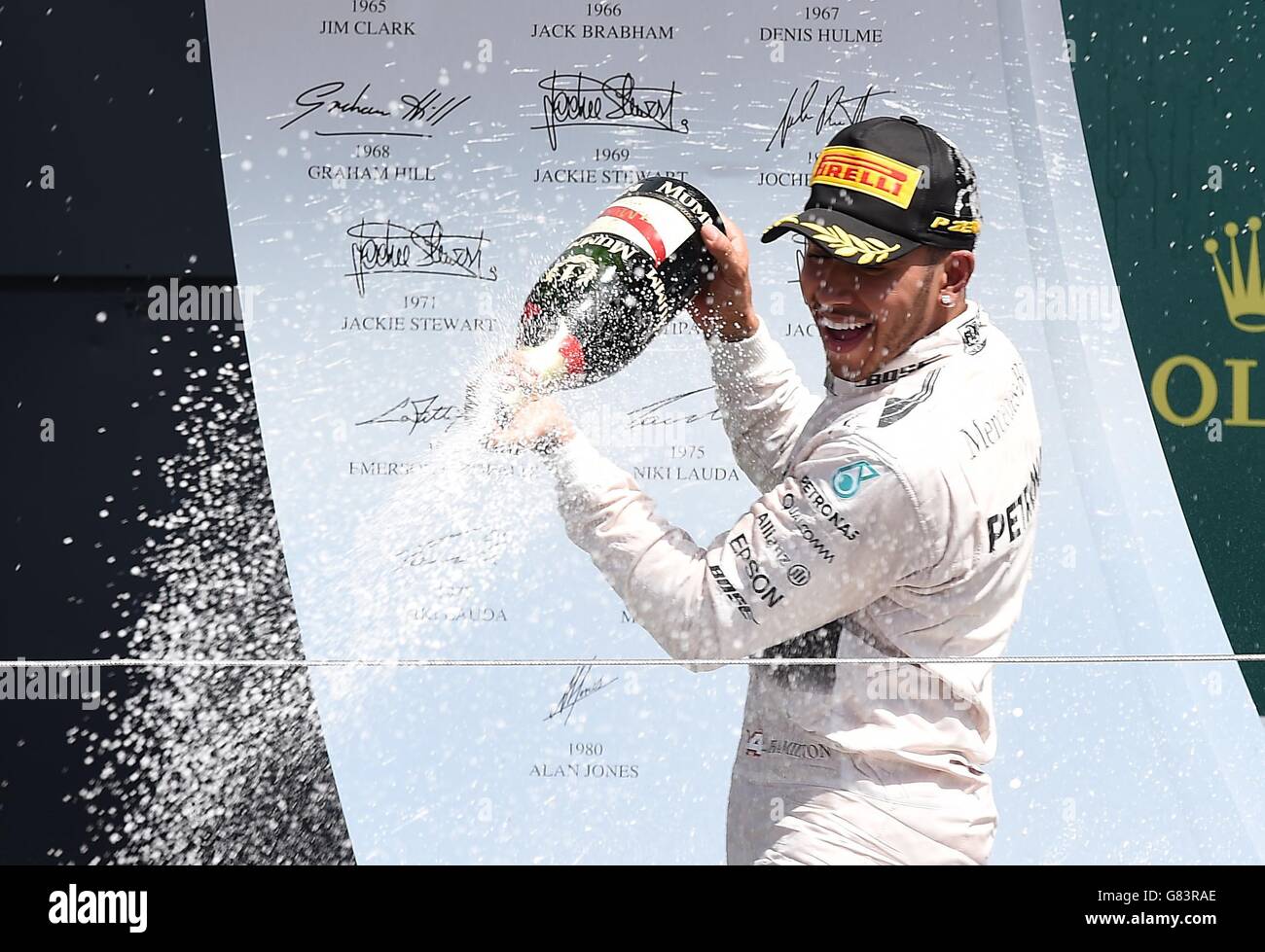 Mercedes driver Lewis Hamilton celebrates winning the 2015 British ...