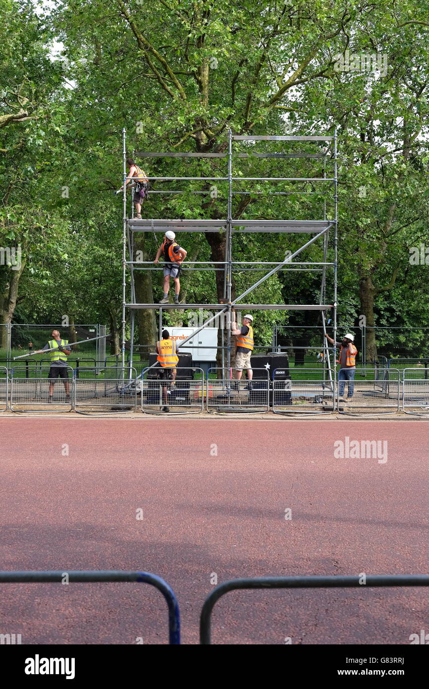 Workmen building a platform for a camera crew to film the Queens 90th ...