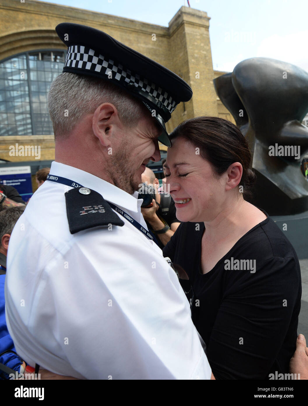 7/7 survivor Gill Hicks hugs PC Andy Maxwell, who came to her aid when ...