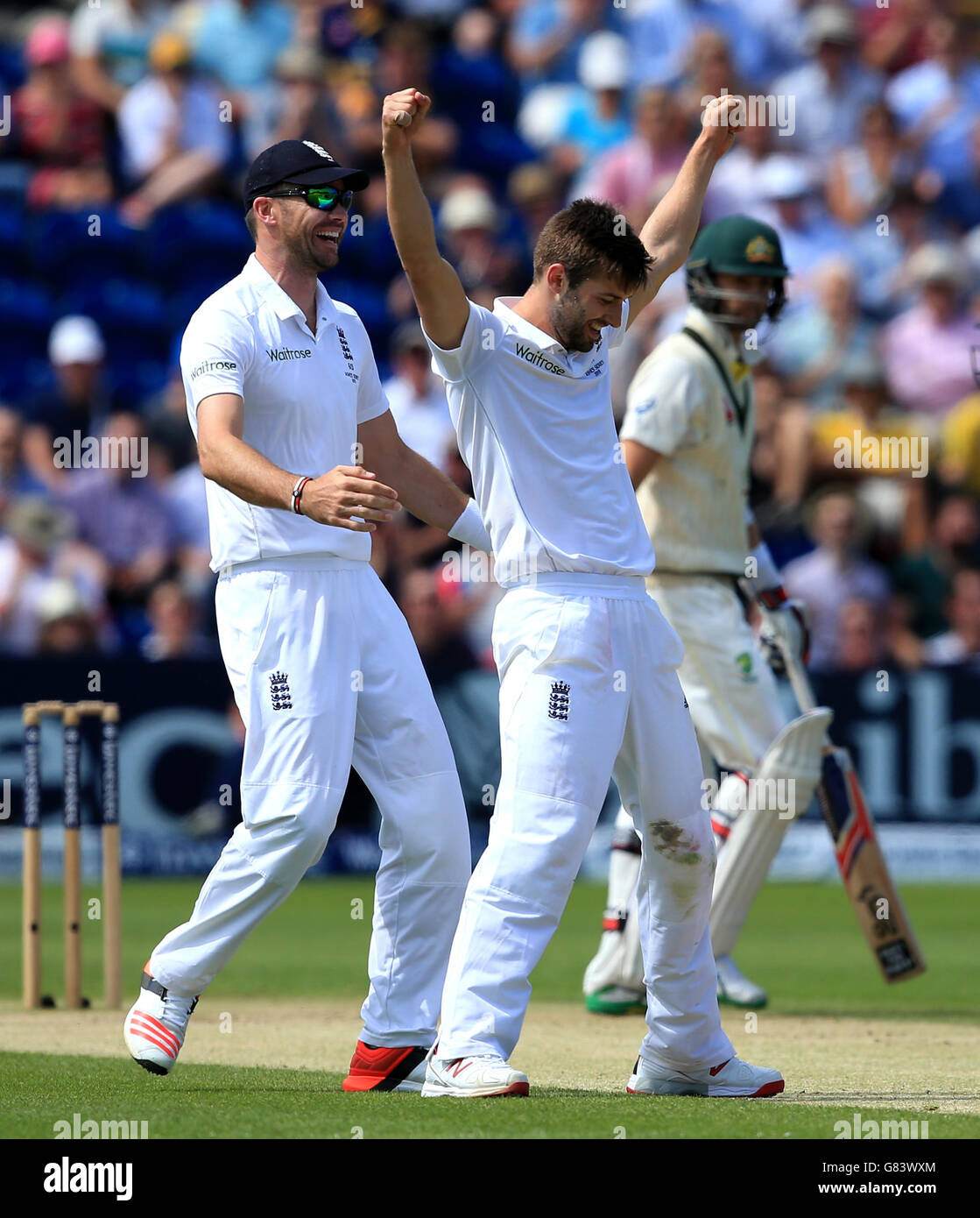 England bowler Mark Wood celebrates with James Anderson as he traps ...