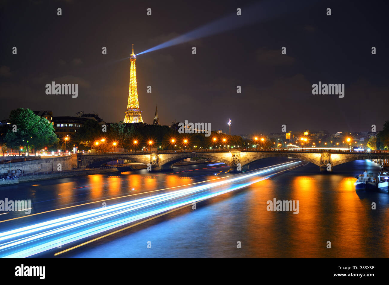 PARIS, FRANCE - MAY 13: Eiffel Tower and River Seine at night on May 13 ...