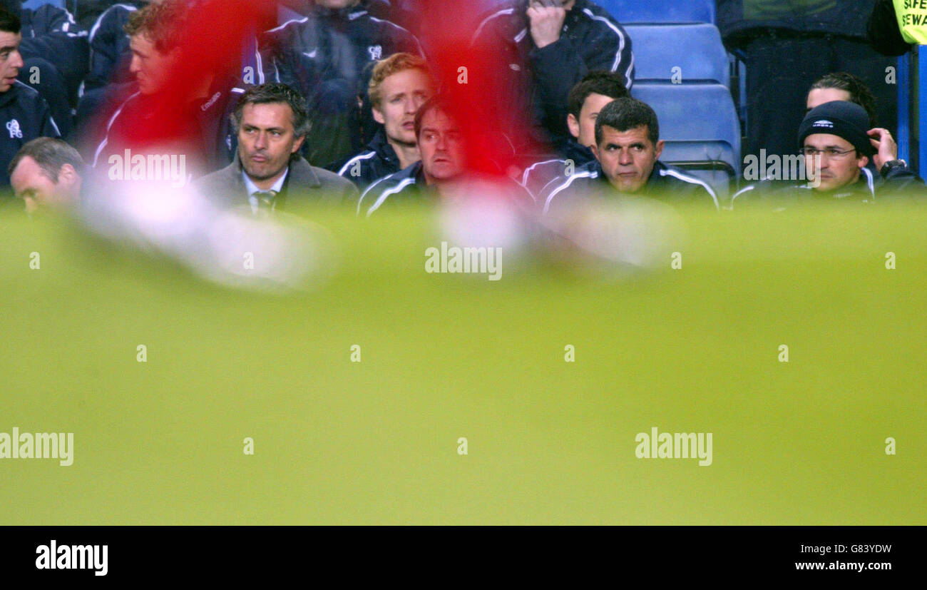 Chelsea manager Jose Mourinho sits on the bench with his assistant ...