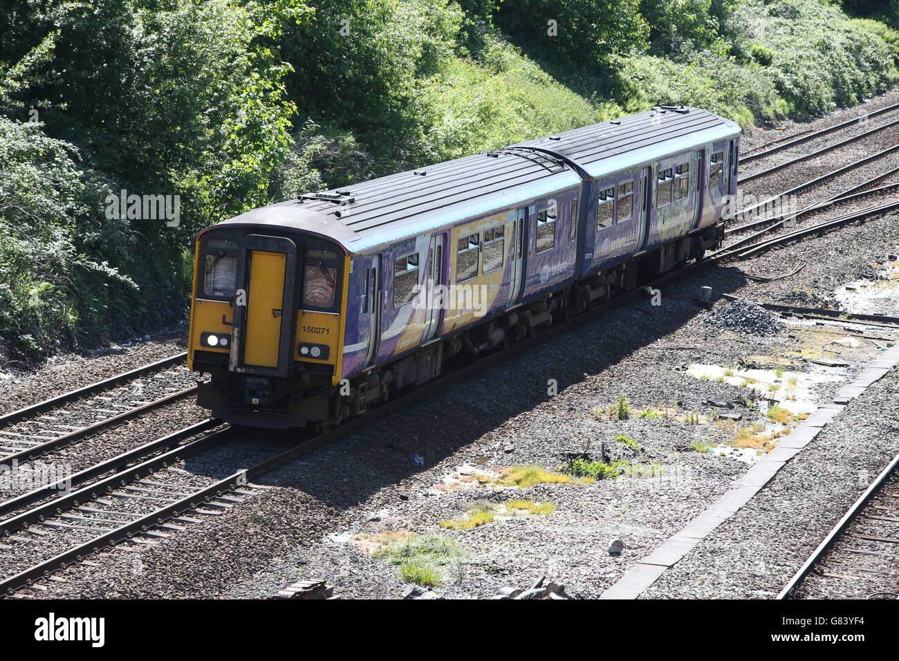 A Northern train passes along track at Hunts Cross station in Liverpool ...