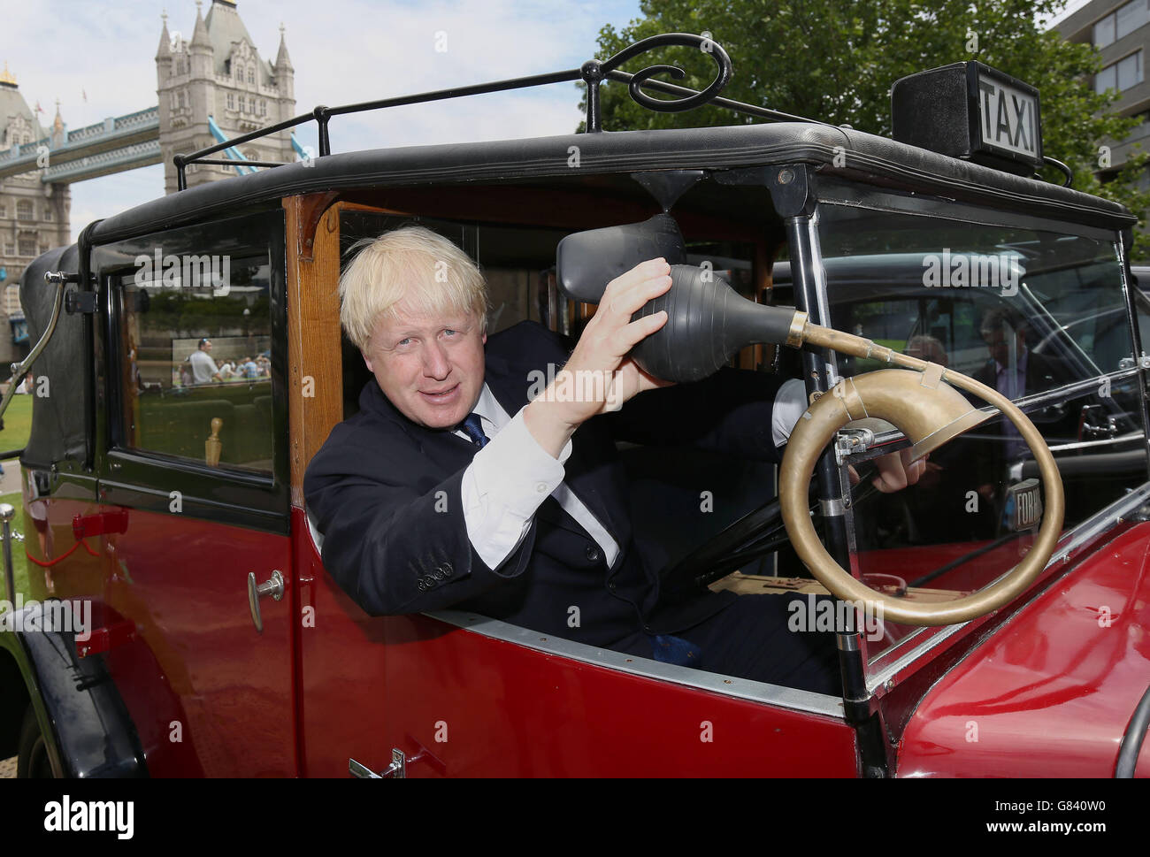 Mayor of London Boris Johnson sits behind the wheel of a 1936 London ...