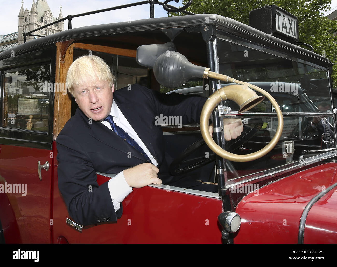 Mayor of London Boris Johnson sits behind the wheel of a 1936 London ...