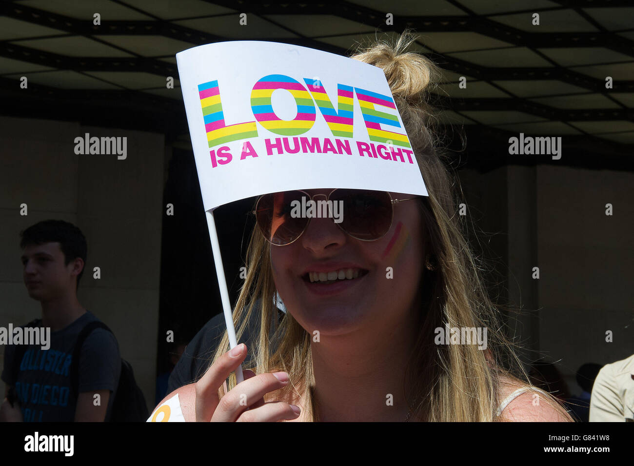 London LGBTQ Parade. A spectator watches the London LGBTQ Parade Stock ...