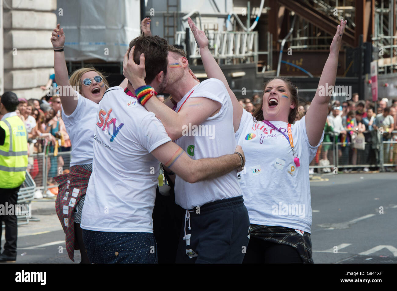 London LGBTQ Parade. Two men kiss during the London LGBTQ Parade Stock ...
