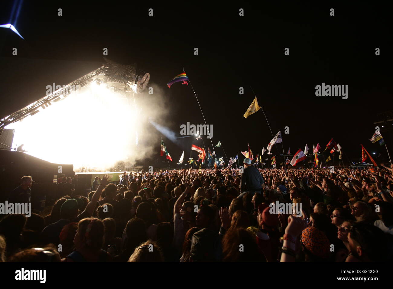 The crowd watch Kanye West performing on The Pyramid Stage at the ...