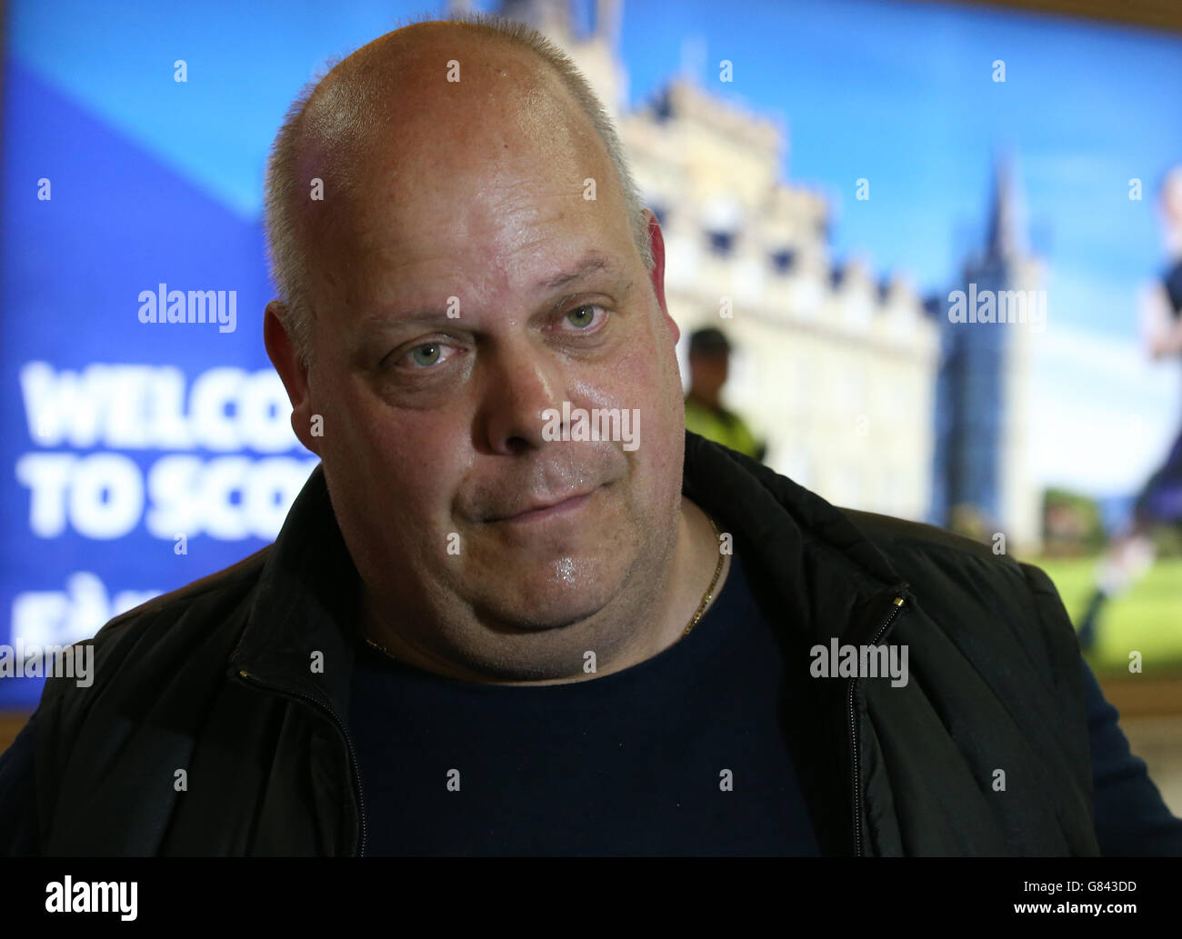 Malcolm Lamont speaks to the media having arrived back at Glasgow ...