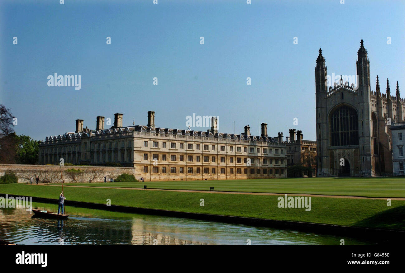 A punt makes its way along the River Cam against a back drop of ...