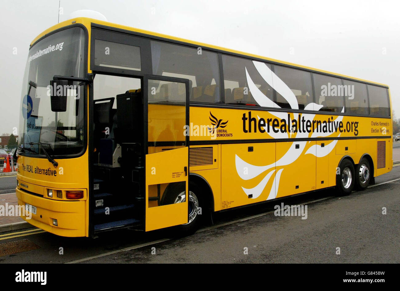 A yellow Liberal Democrat tour bus. Liberal Democrat Leader Charles ...