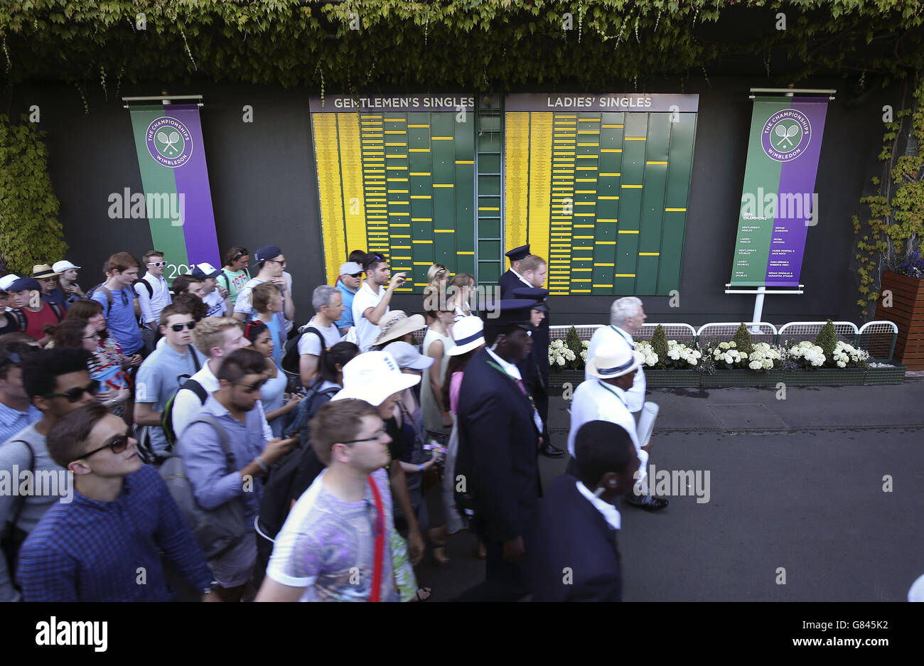 Spectators are led to the courts after the gates have opened, during ...