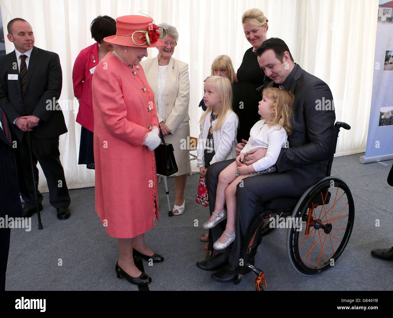 Queen Elizabeth II talks with veteran Lee Aitchison and his wife Linda ...