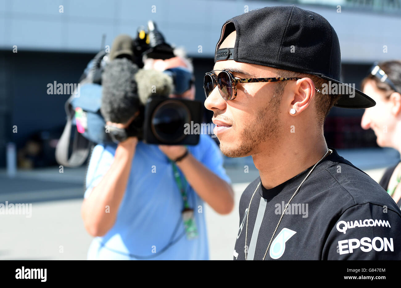 Mercedes driver Lewis Hamilton walks through the Paddock, during ...