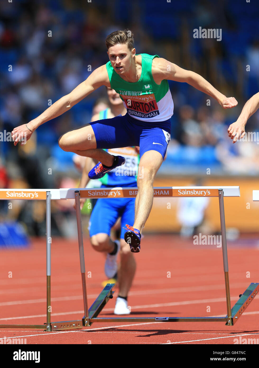 Tom Burton wins his men's 400 metres hurdle heat during day one of the ...