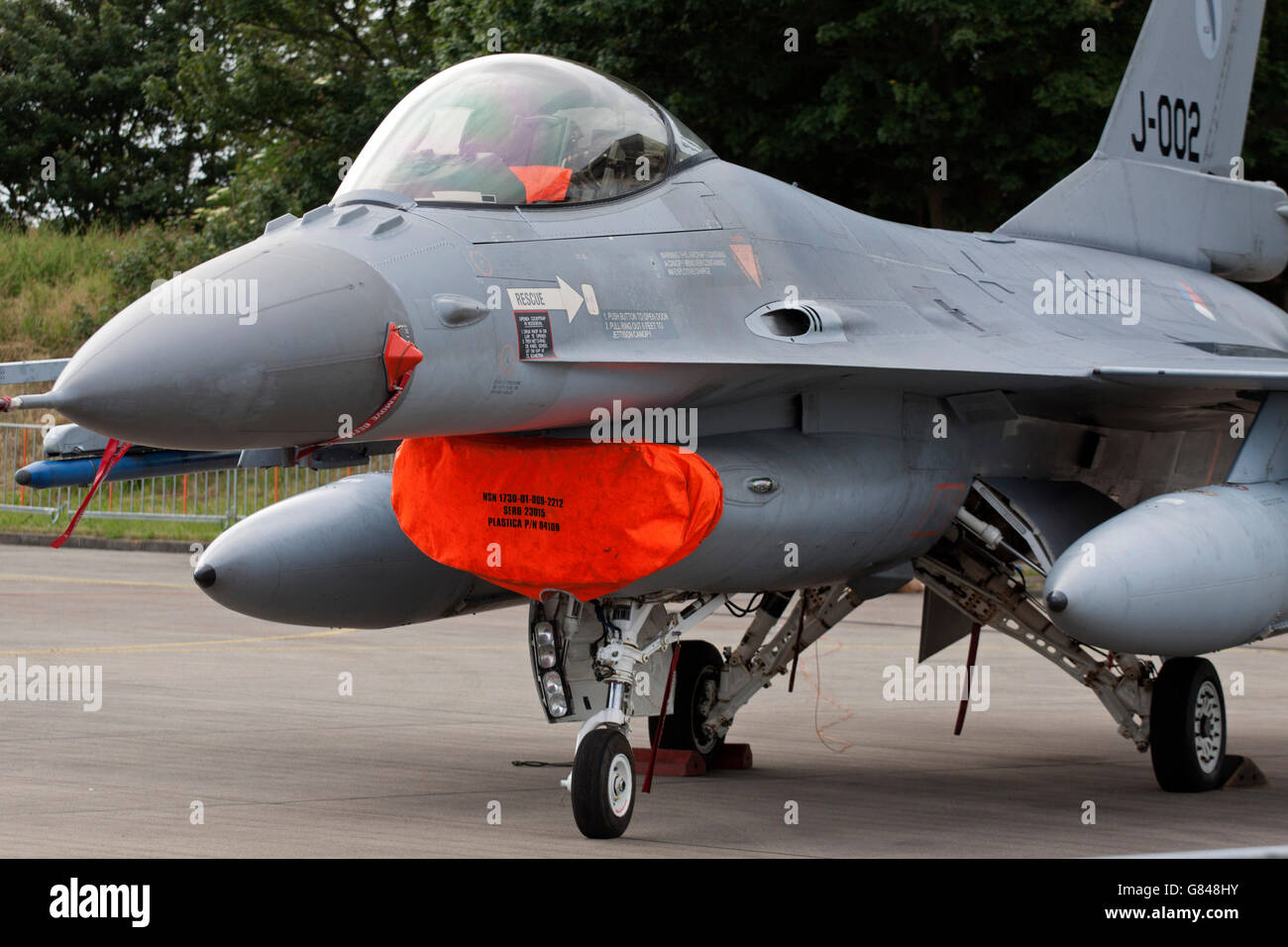 LEEUWARDEN, NETHERLANDS - JUNI 11 2016 F16 fighter jet during the air show in Leeuwarden. people ...