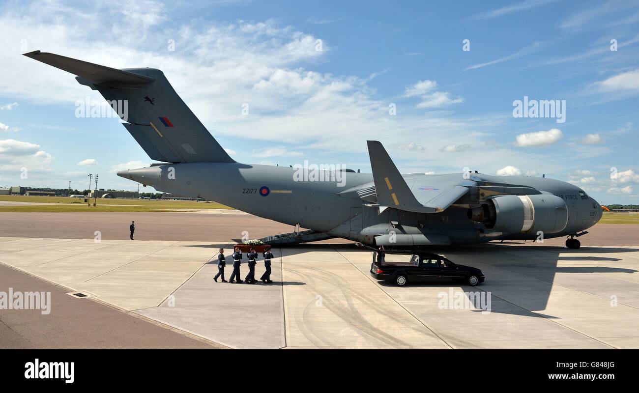 The coffin of Lisa Burbidge is carried from the RAF C-17 at RAF Brize ...