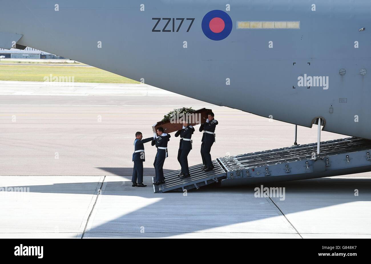 The coffin of Lisa Burbidge is carried from the RAF C-17 at RAF Brize ...