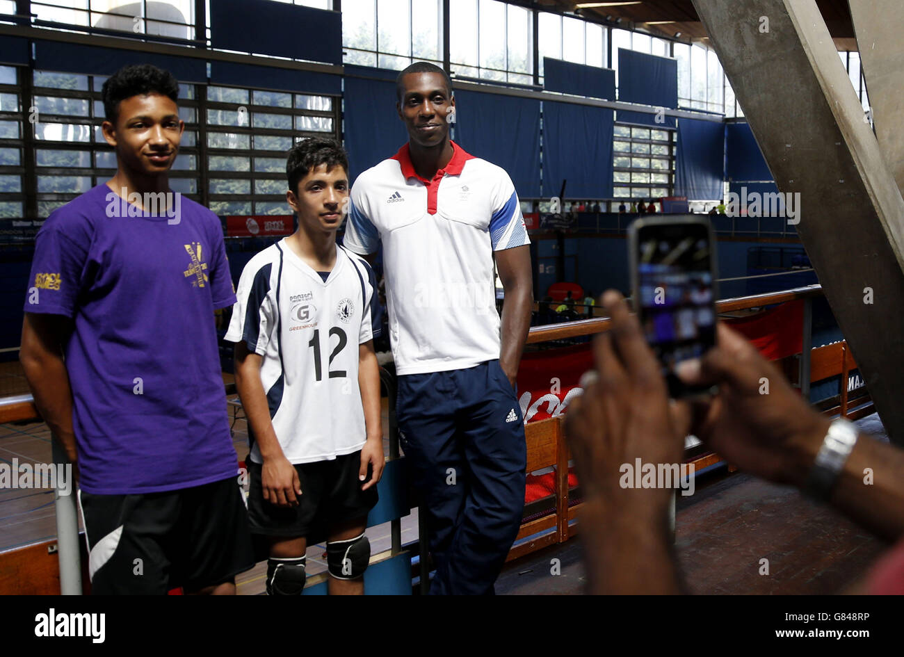 GB Volleyball player Dami Bakare (right) poses for a photograph with ...
