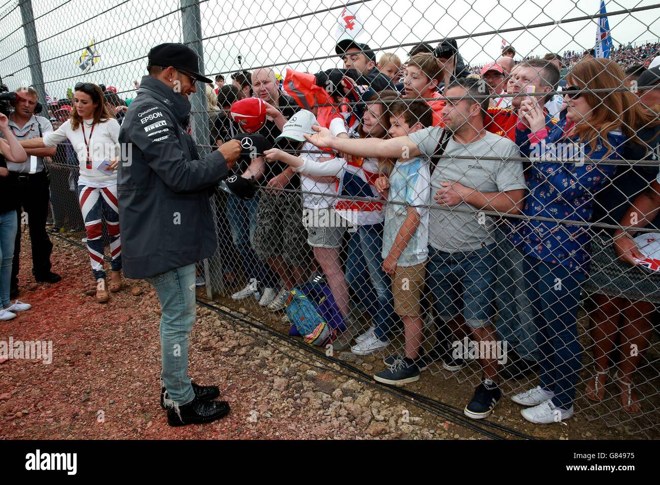 Lewis hamilton signs autographs for fans at silverstone hi-res stock ...