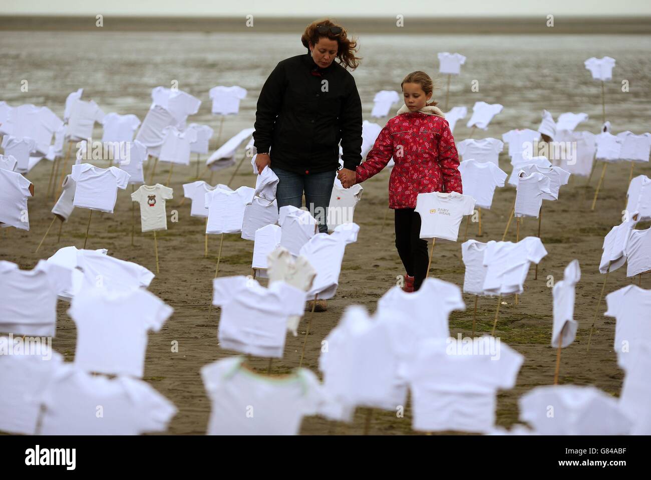 Neili Conroy and her daughter Juno, 9, visit an art installation on ...