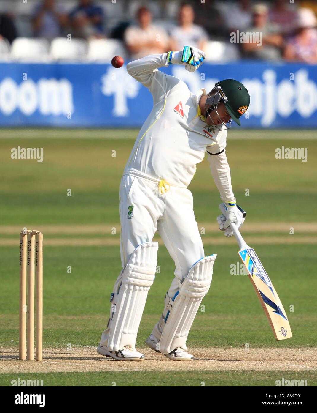 Australia captain Michael Clarke winces as he is hit on the hand during ...